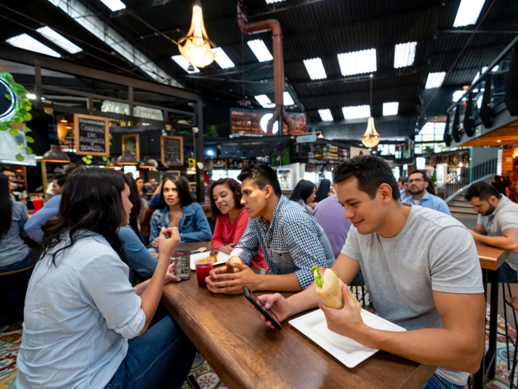 How can you lighten the material management of a multi-brand food court?